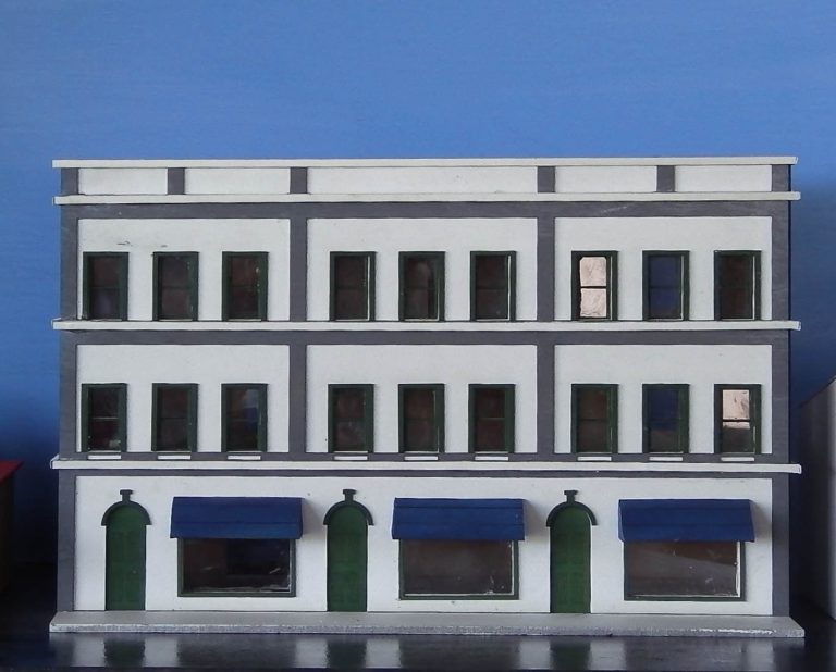 HO scale 3 story office block with shops (KIT) - Walker Models
